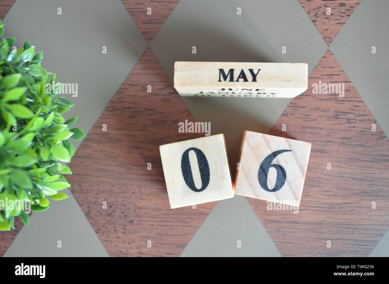 Date of May with leaf on diamond pattern table for background Stock ...