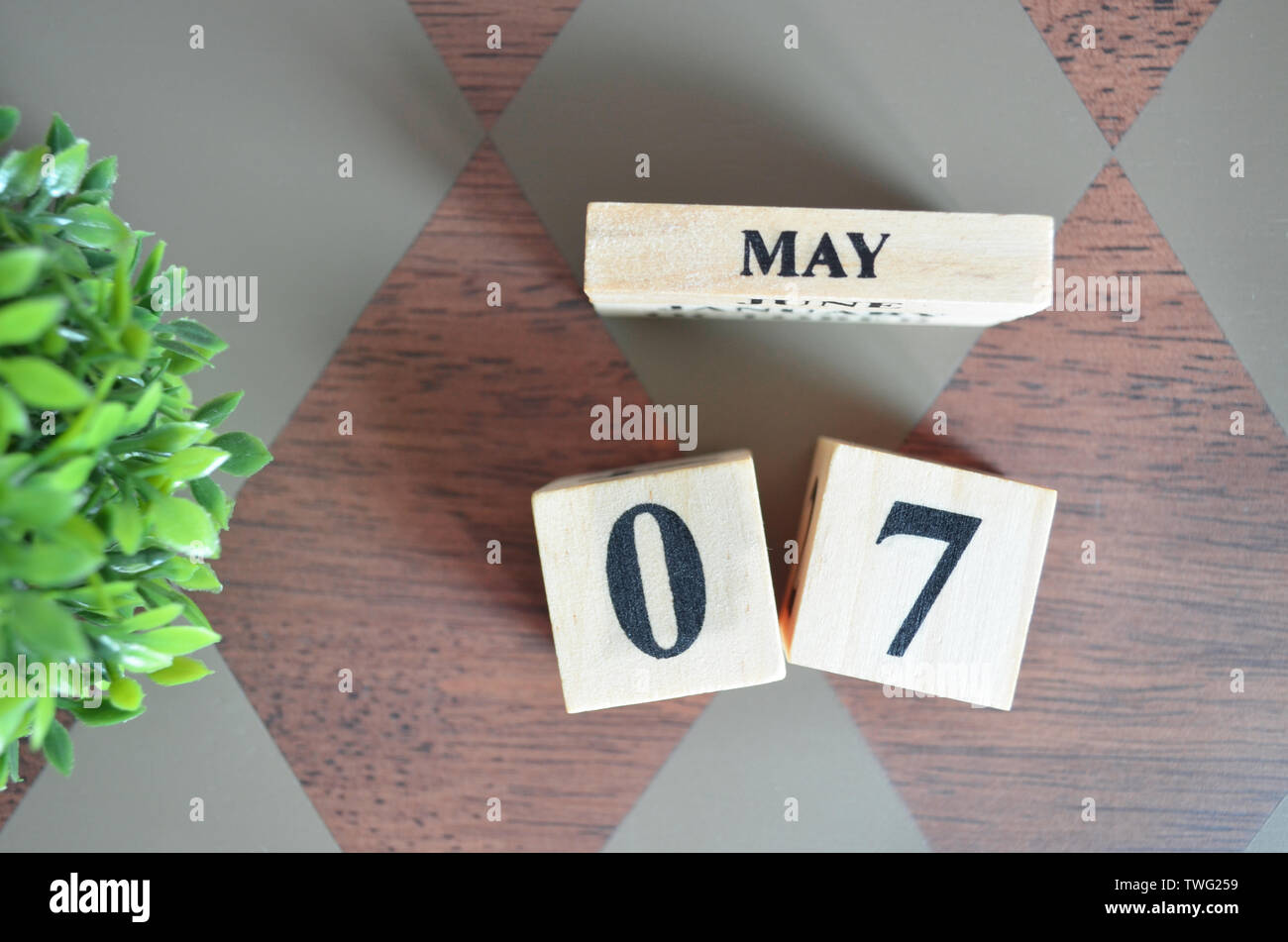 Date of May with leaf on diamond pattern table for background Stock ...