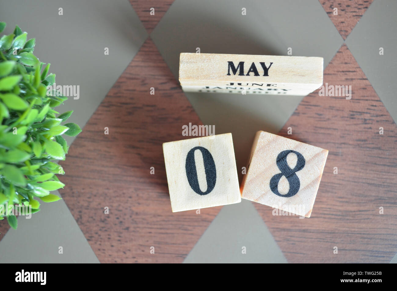 Date of May with leaf on diamond pattern table for background Stock ...