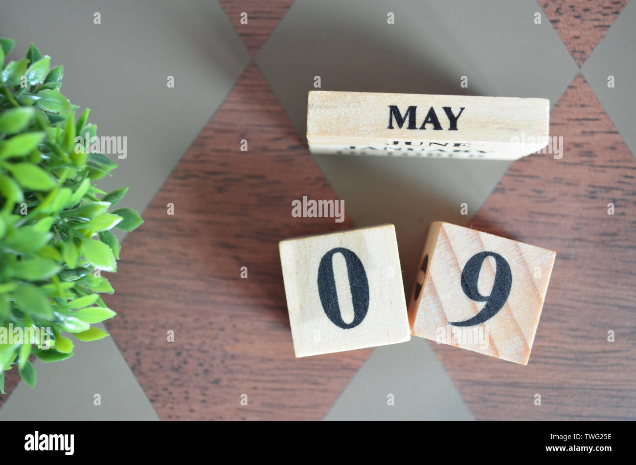Date of May with leaf on diamond pattern table for background Stock ...