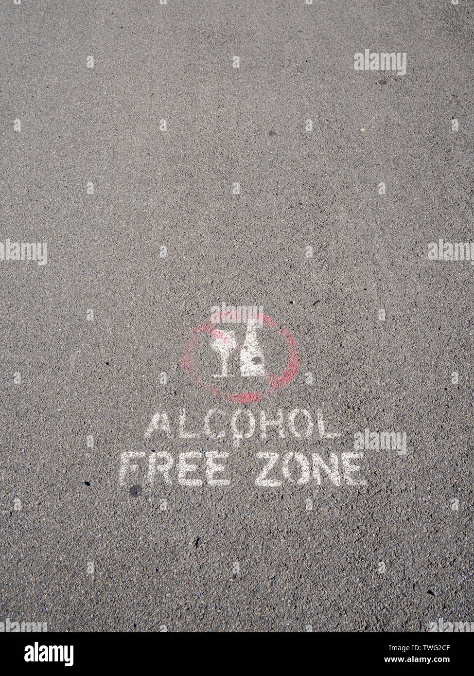 An alcohol free zone sign painted on the road in New Zealand ...