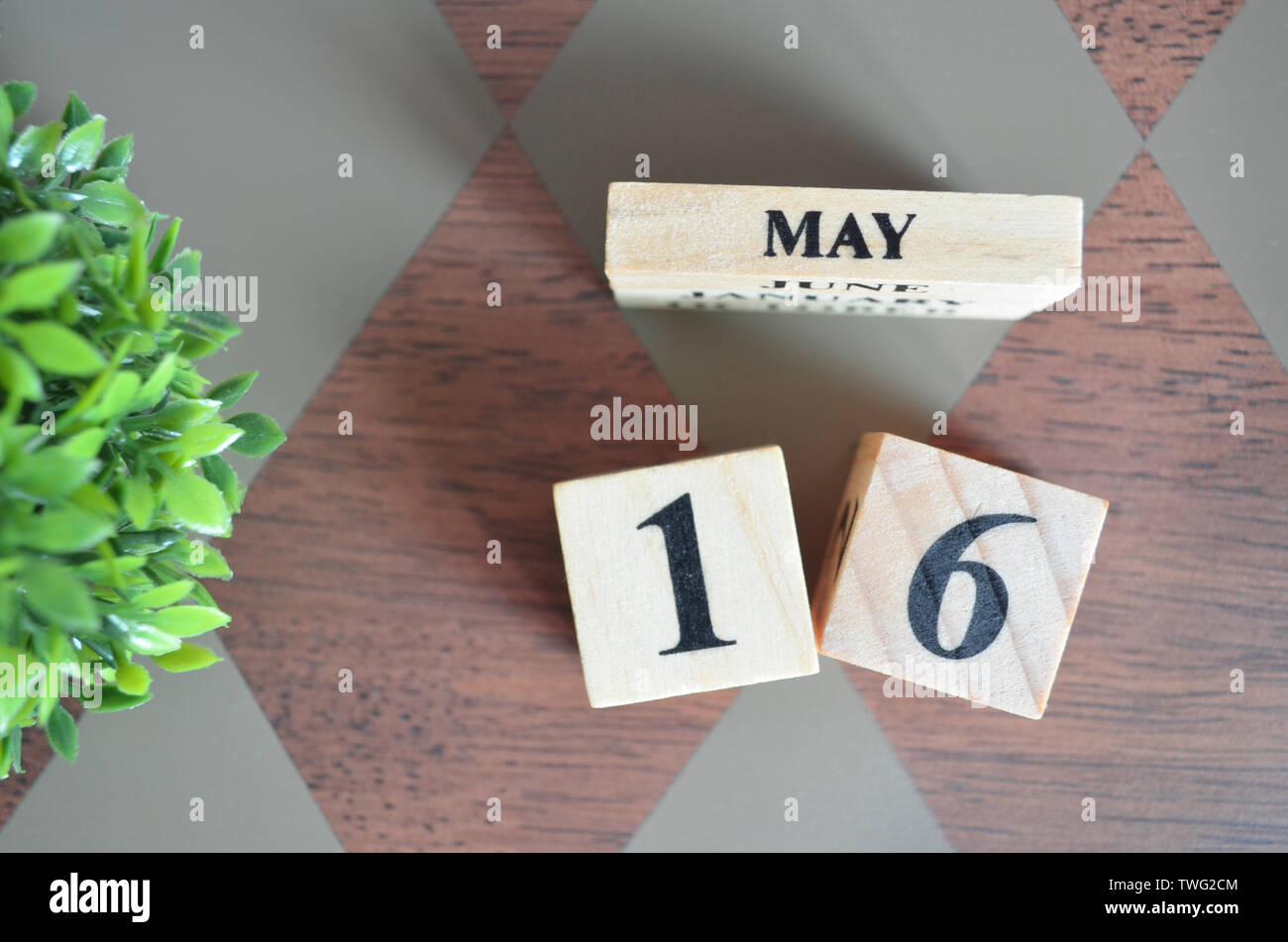 Date of May with leaf on diamond pattern table for background Stock ...