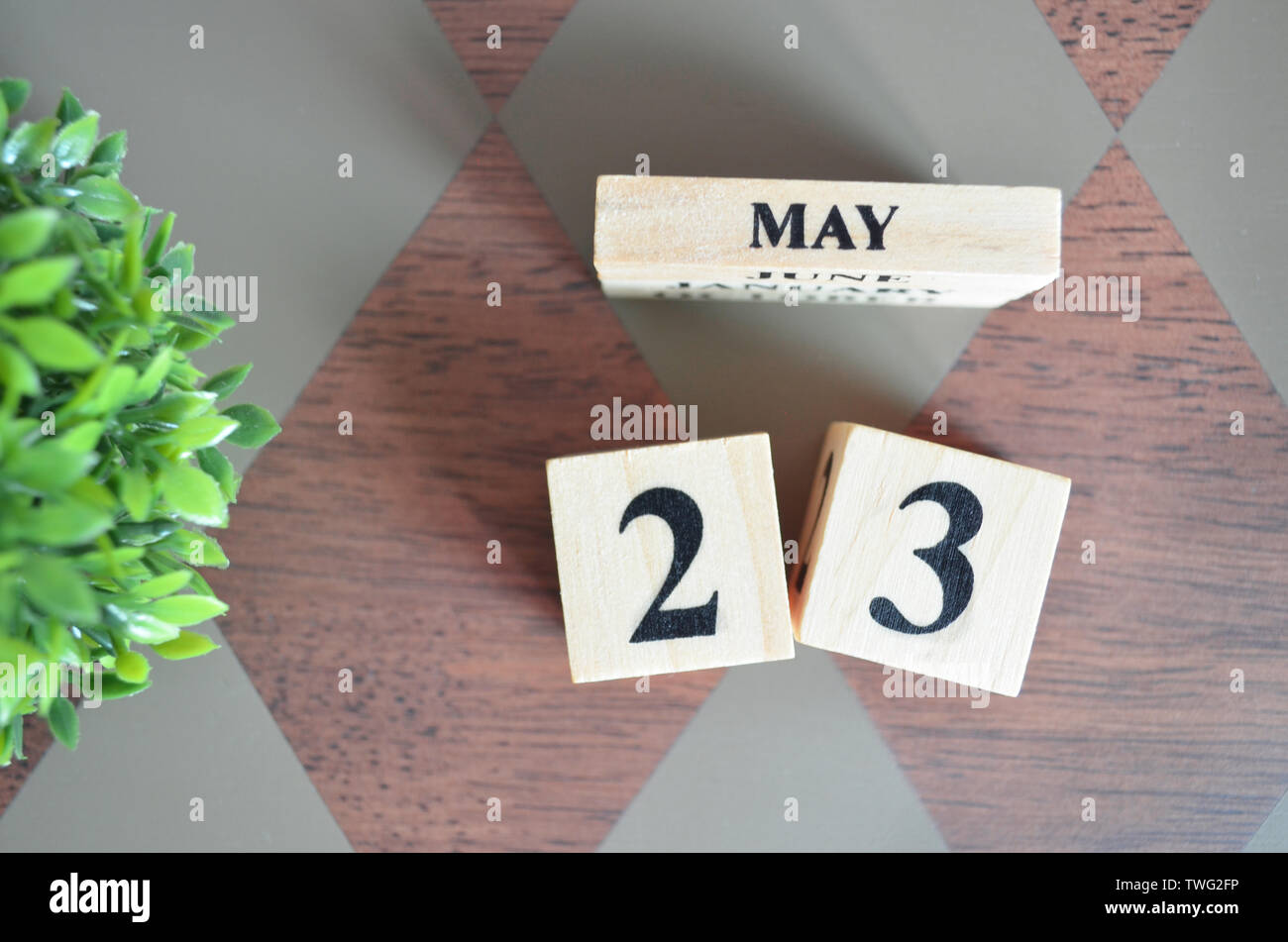 Date of May with leaf on diamond pattern table for background Stock ...