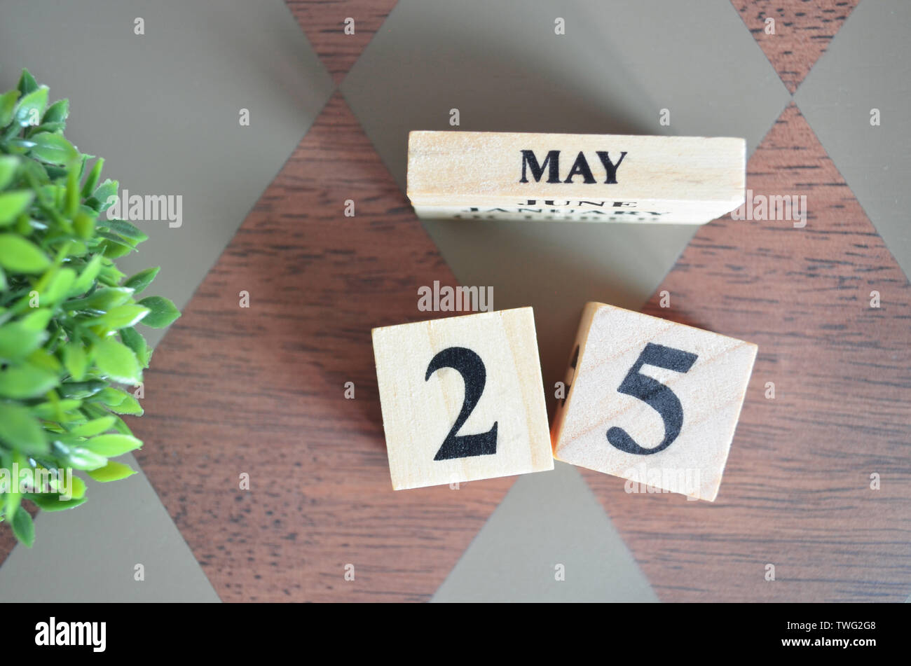 Date of May with leaf on diamond pattern table for background Stock ...
