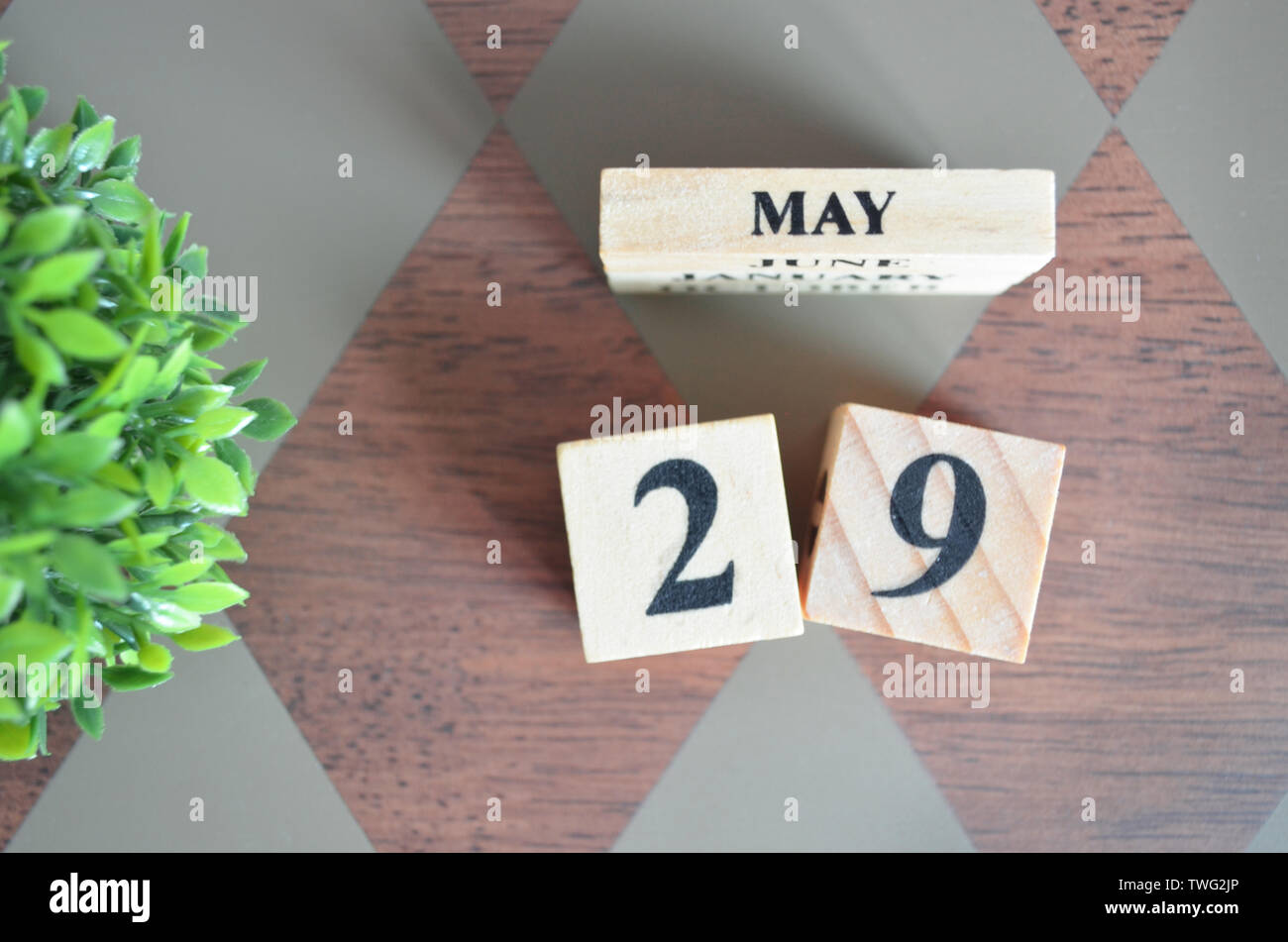 Date of May with leaf on diamond pattern table for background Stock ...