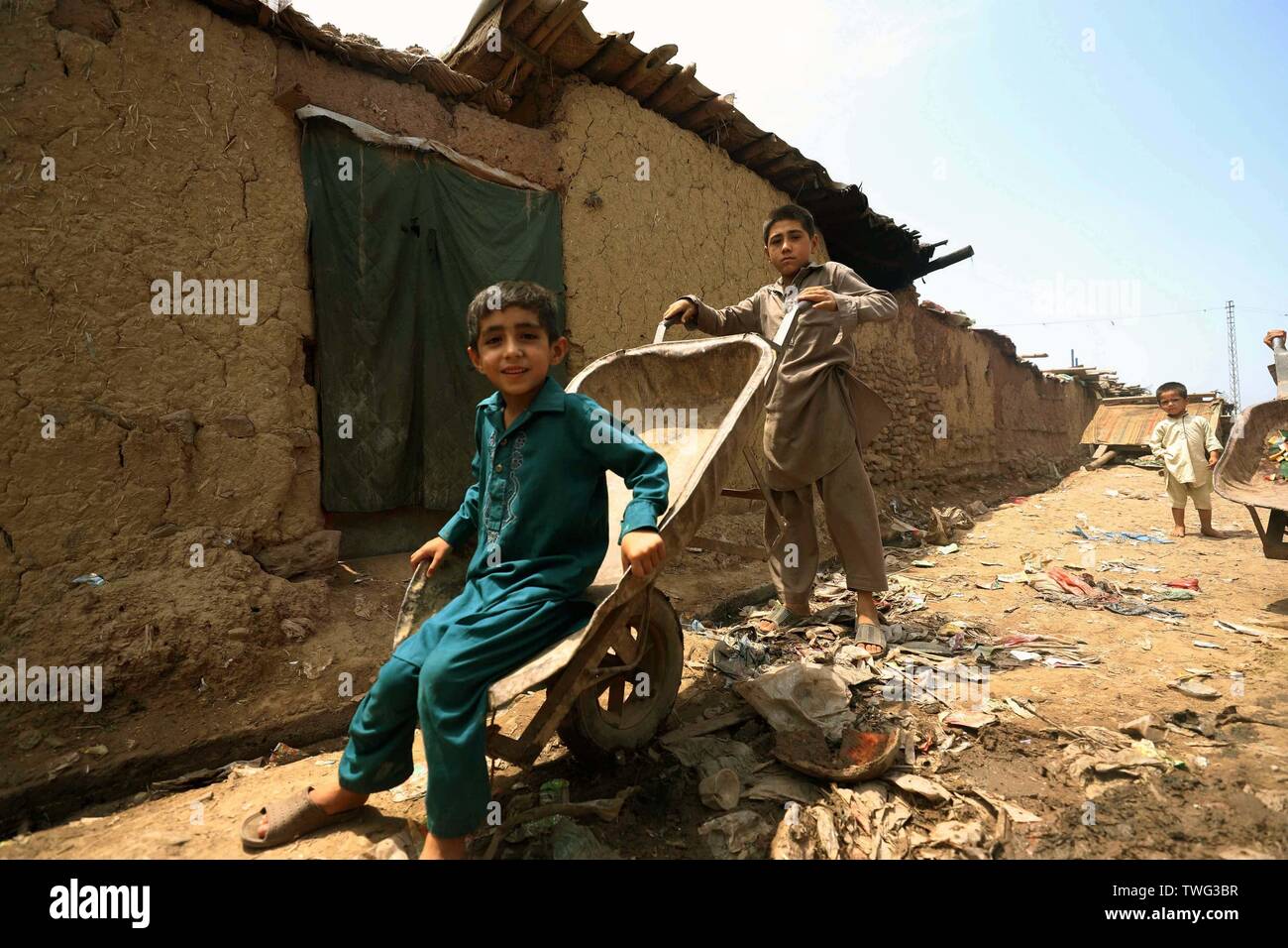 Islamabad. 20th June, 2019. Afghan refugee children play at a slum on ...