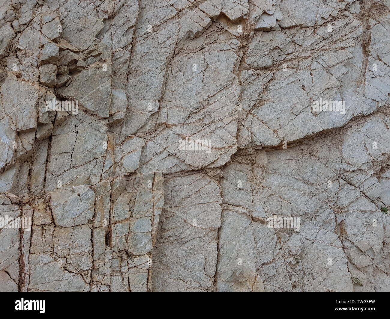 Texture of grey stone riddled with cracks Stock Photo - Alamy