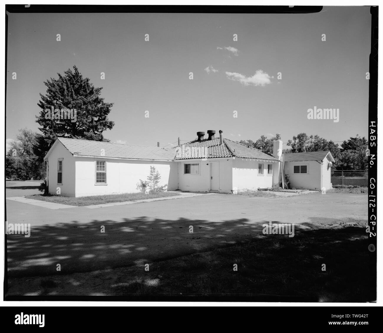 Projecting north wing on left, older part of building center, and ...