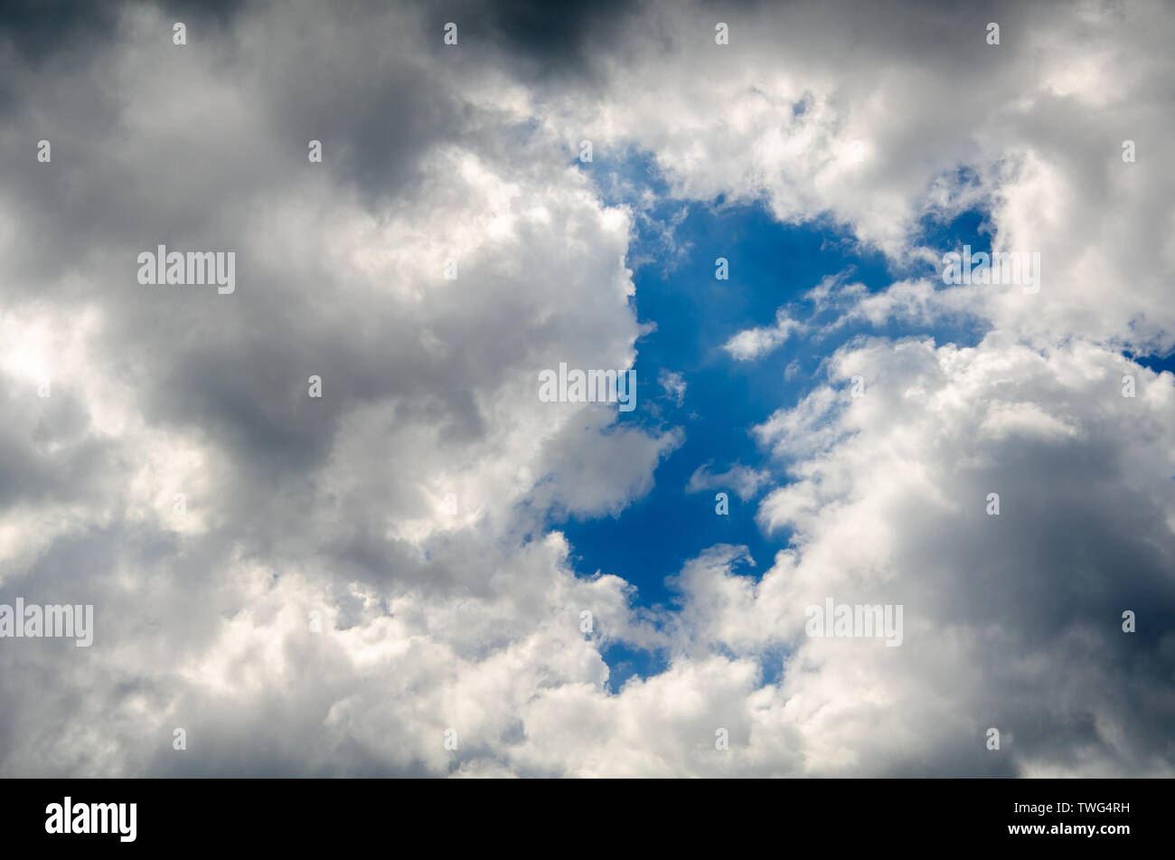 Blue sky background with gray clouds Stock Photo - Alamy