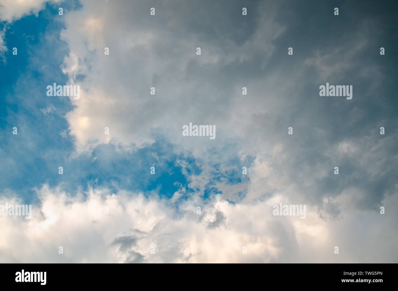 Blue sky background with gray clouds Stock Photo - Alamy