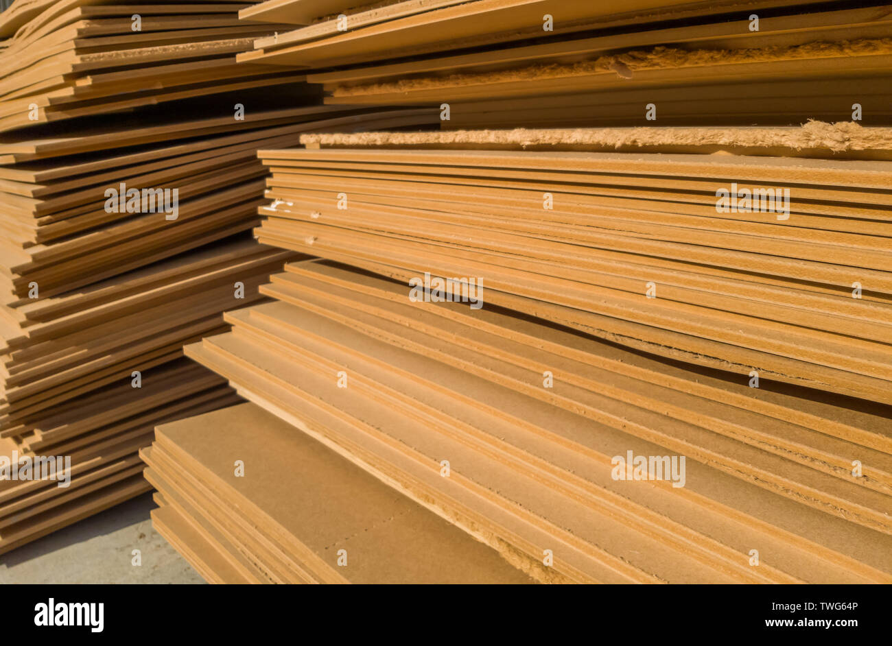 Stacks of old MDF of poor quality. Selective focus Stock Photo - Alamy