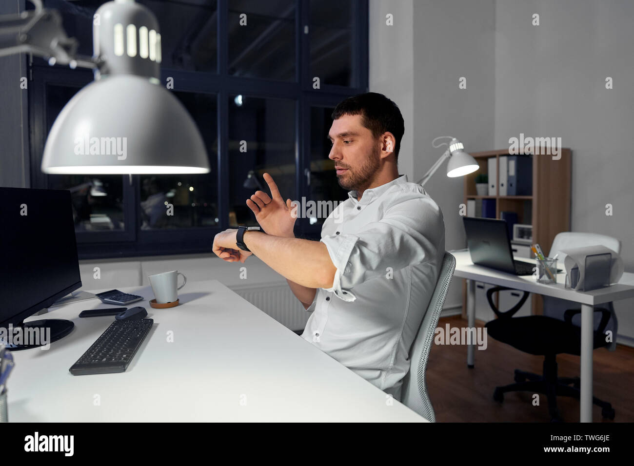 Businessman using smartwatch hi-res stock photography and images - Alamy