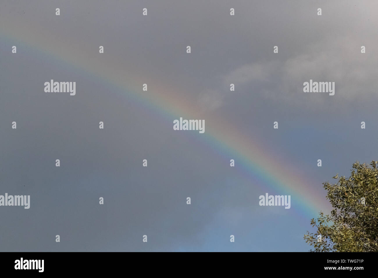 Bright rainbow in sky hi-res stock photography and images - Alamy