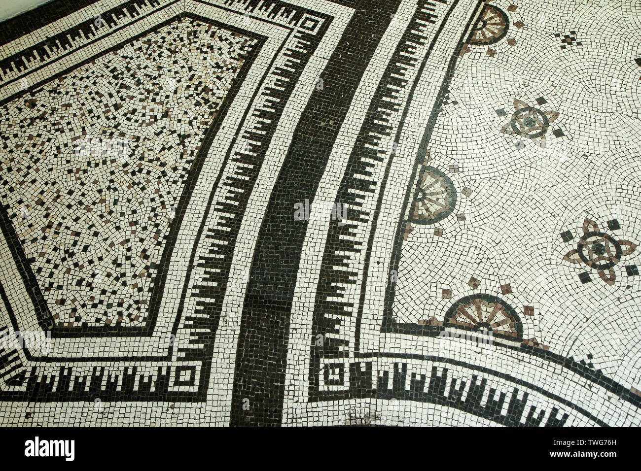 A detail of the ornamental retro mosaic on the floor in an old house ...