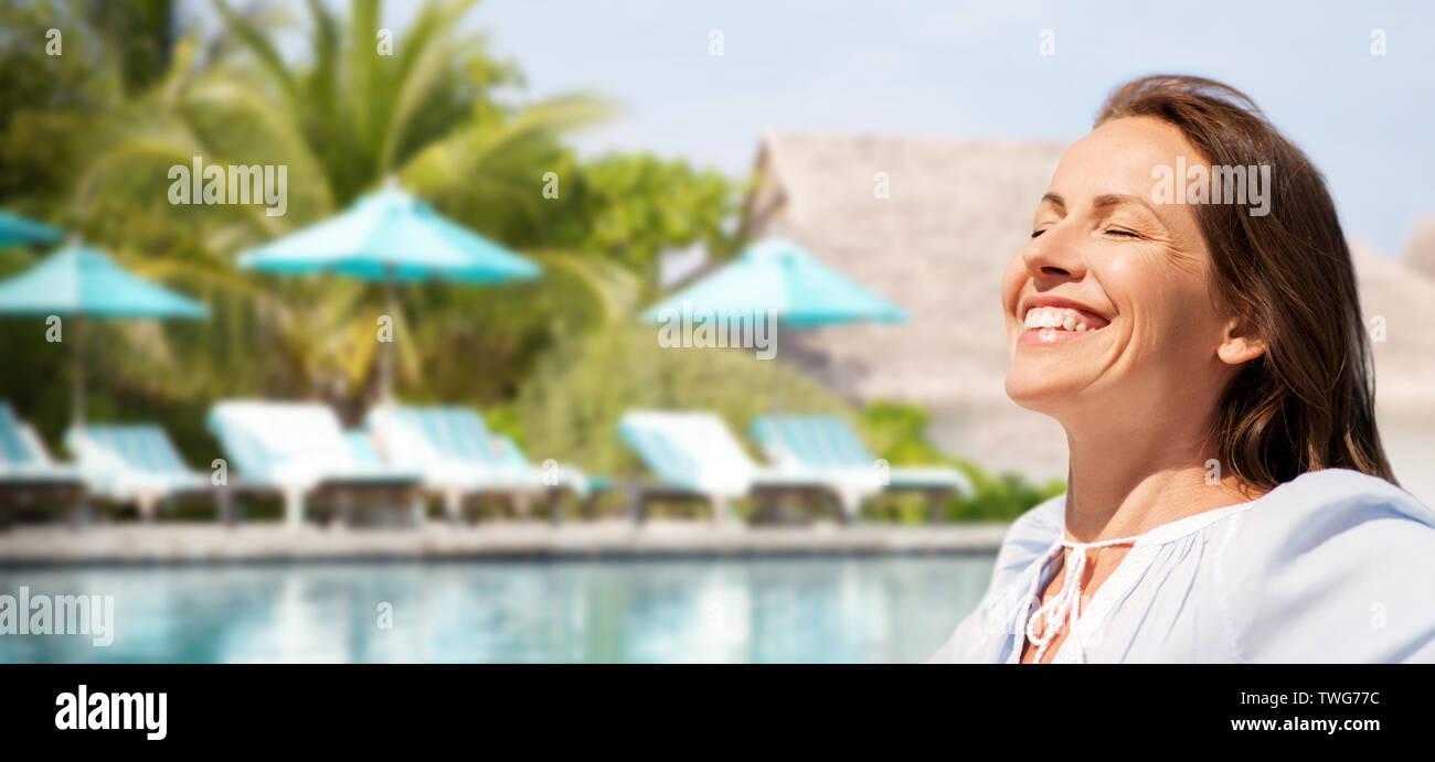 happy woman over swimming pool of touristic resort Stock Photo - Alamy