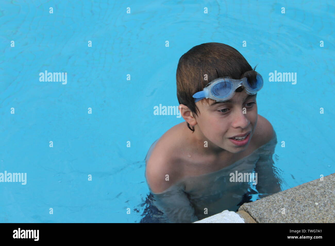 Portrait of a young boy in swimming pool at resort in Sri Lanka Stock ...