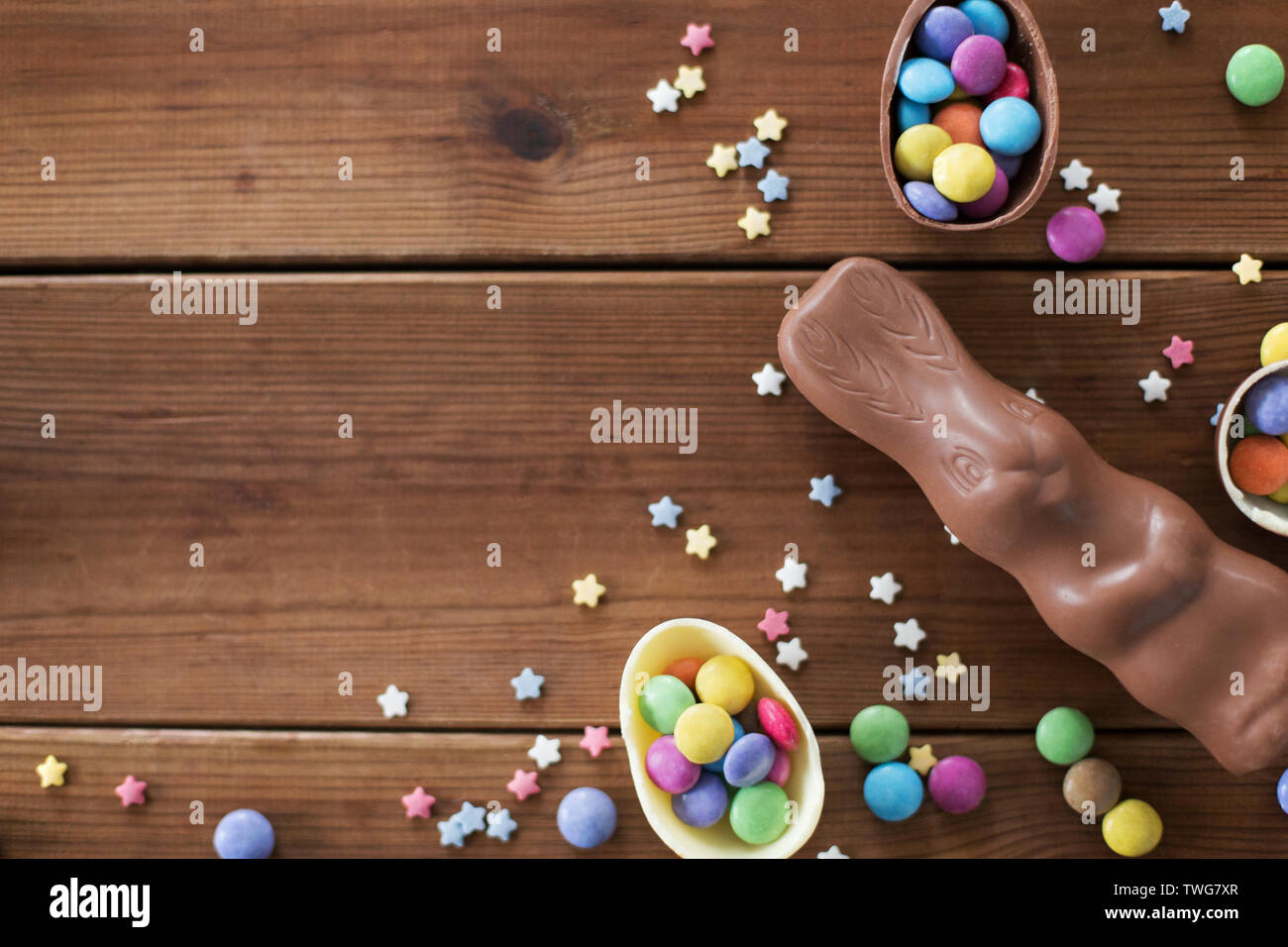 chocolate eggs, easter bunny and candies on wood Stock Photo - Alamy