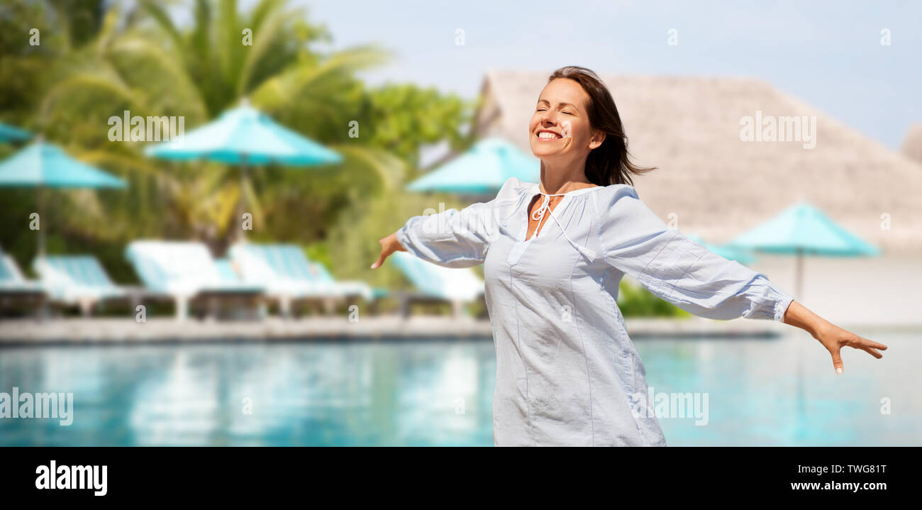 happy woman over swimming pool of touristic resort Stock Photo - Alamy