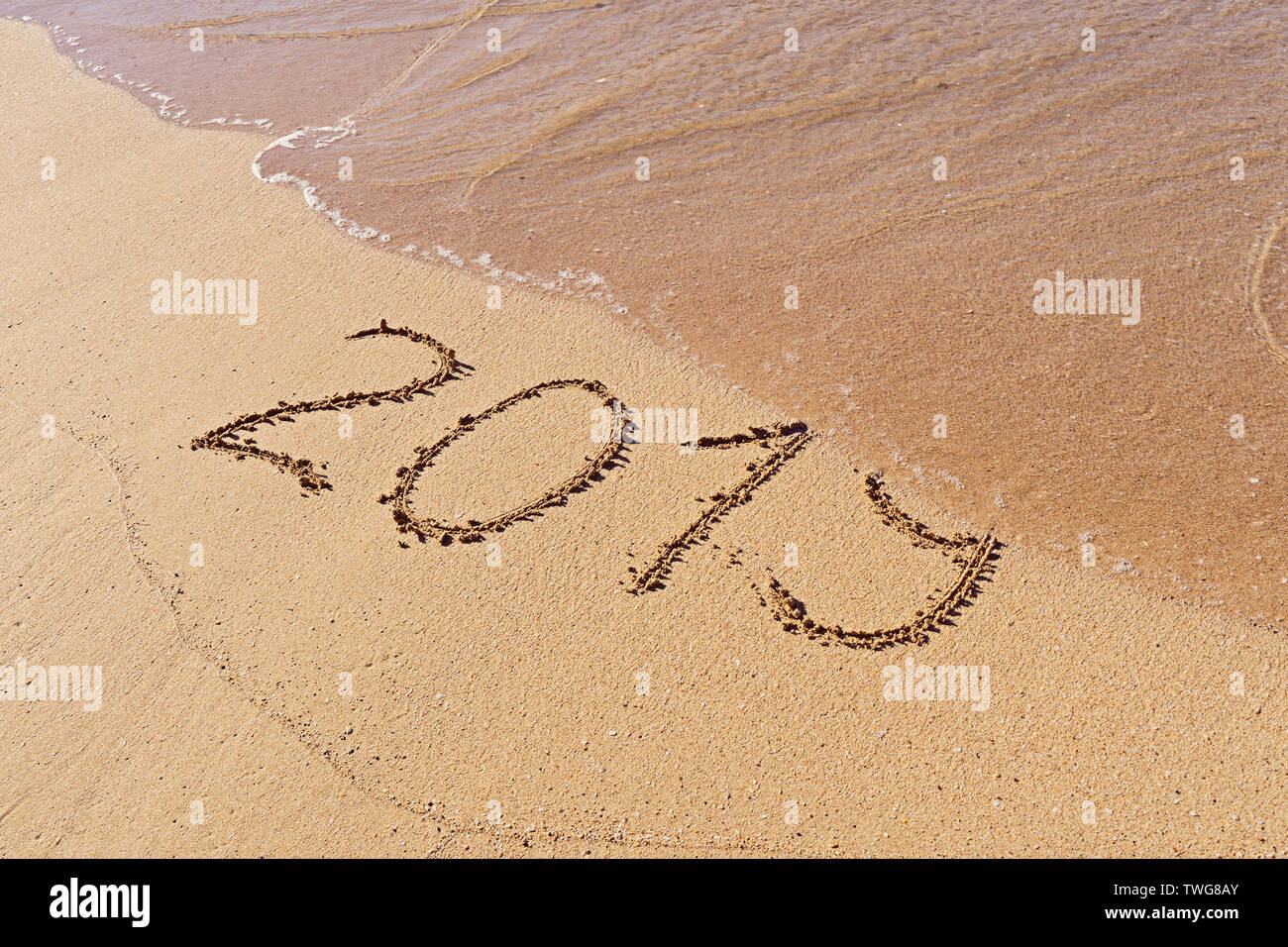 Concept of the calendar year change to 2020. 2019 handwritten text on a ...