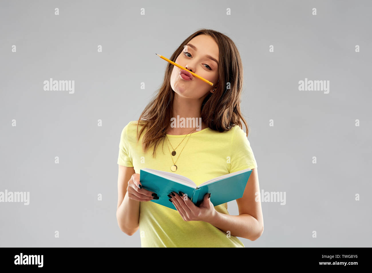 teenage student girl with notebook and pencil Stock Photo - Alamy