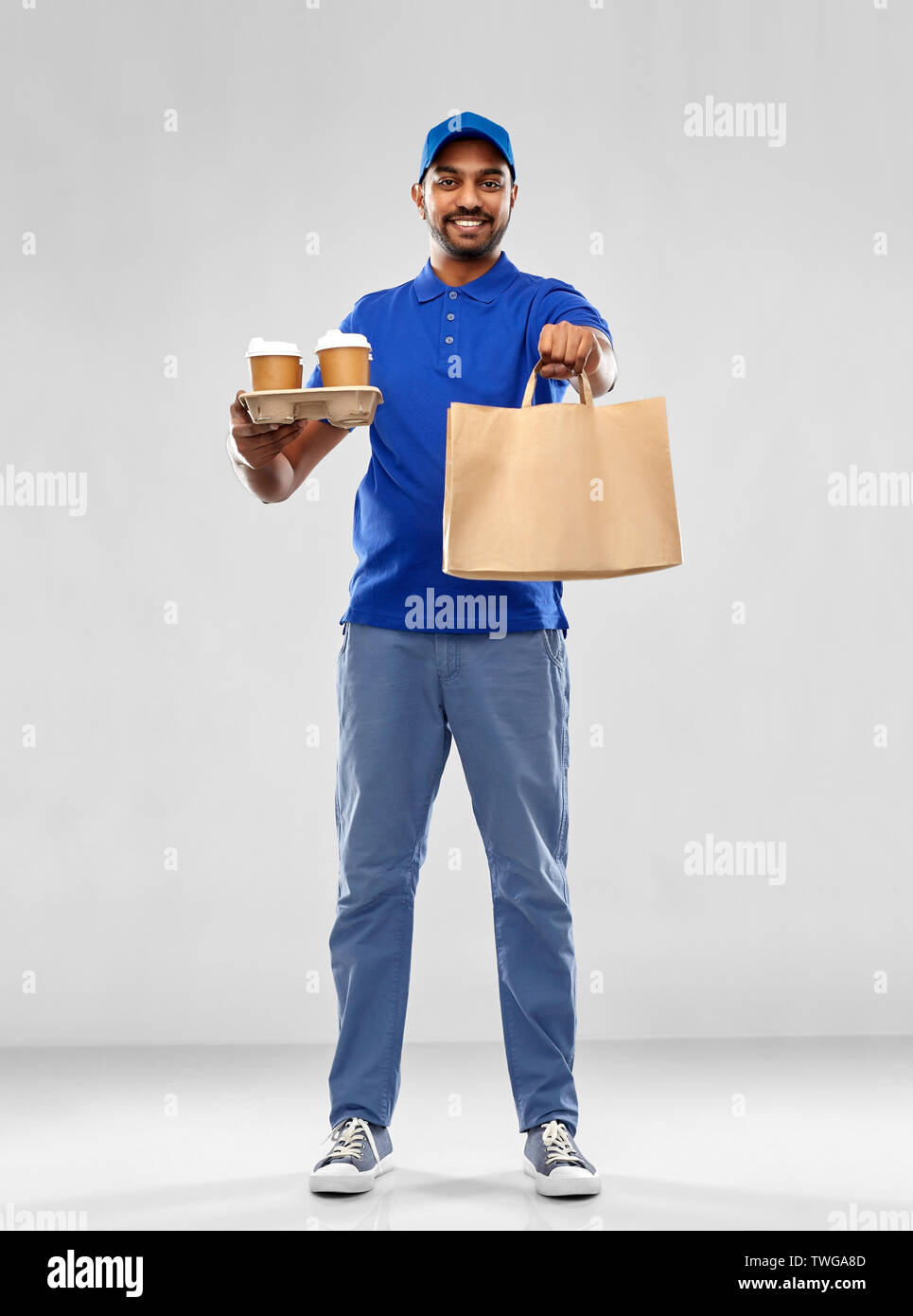 happy indian delivery man with food and drinks Stock Photo - Alamy