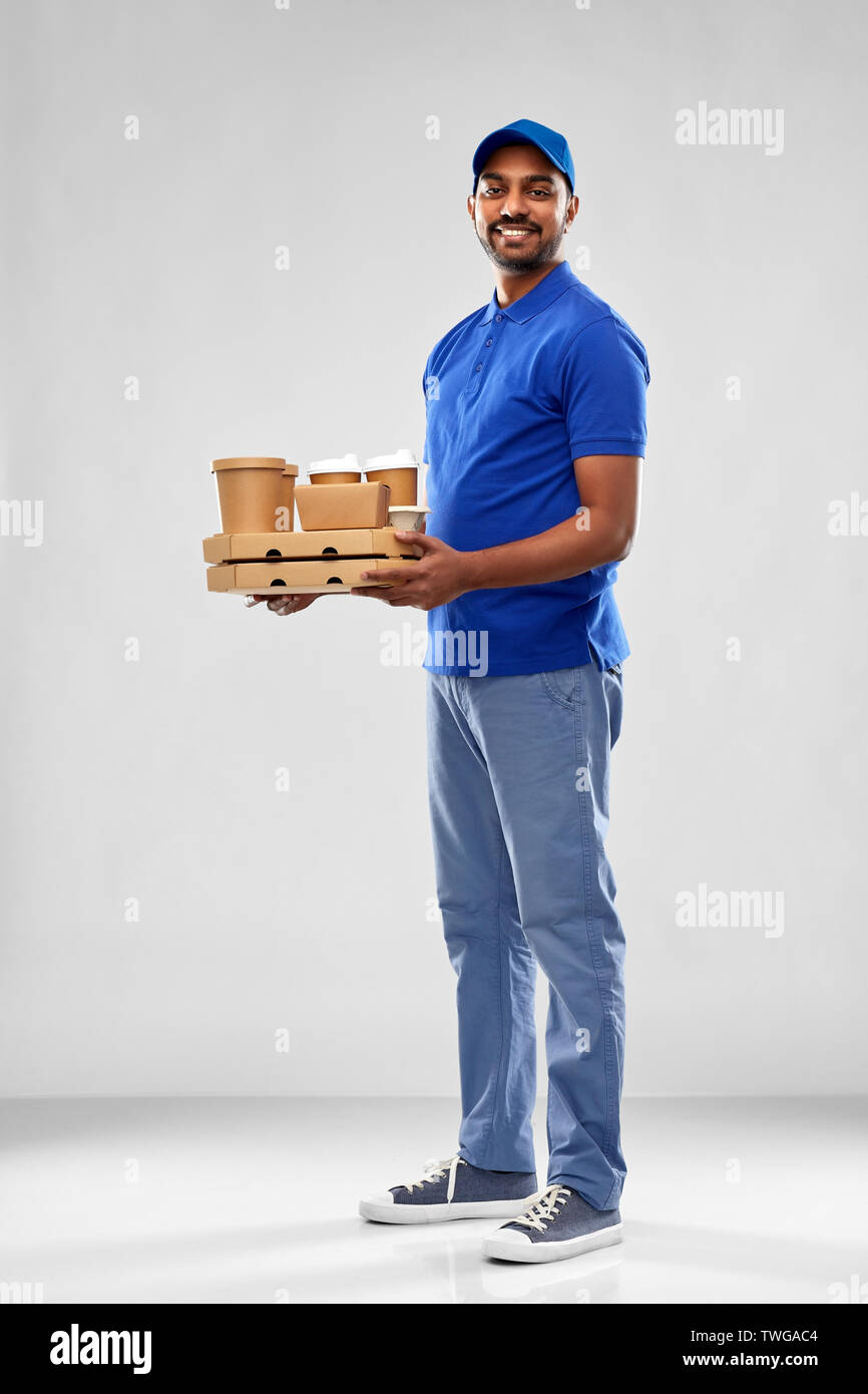 happy indian delivery man with food and drinks Stock Photo - Alamy