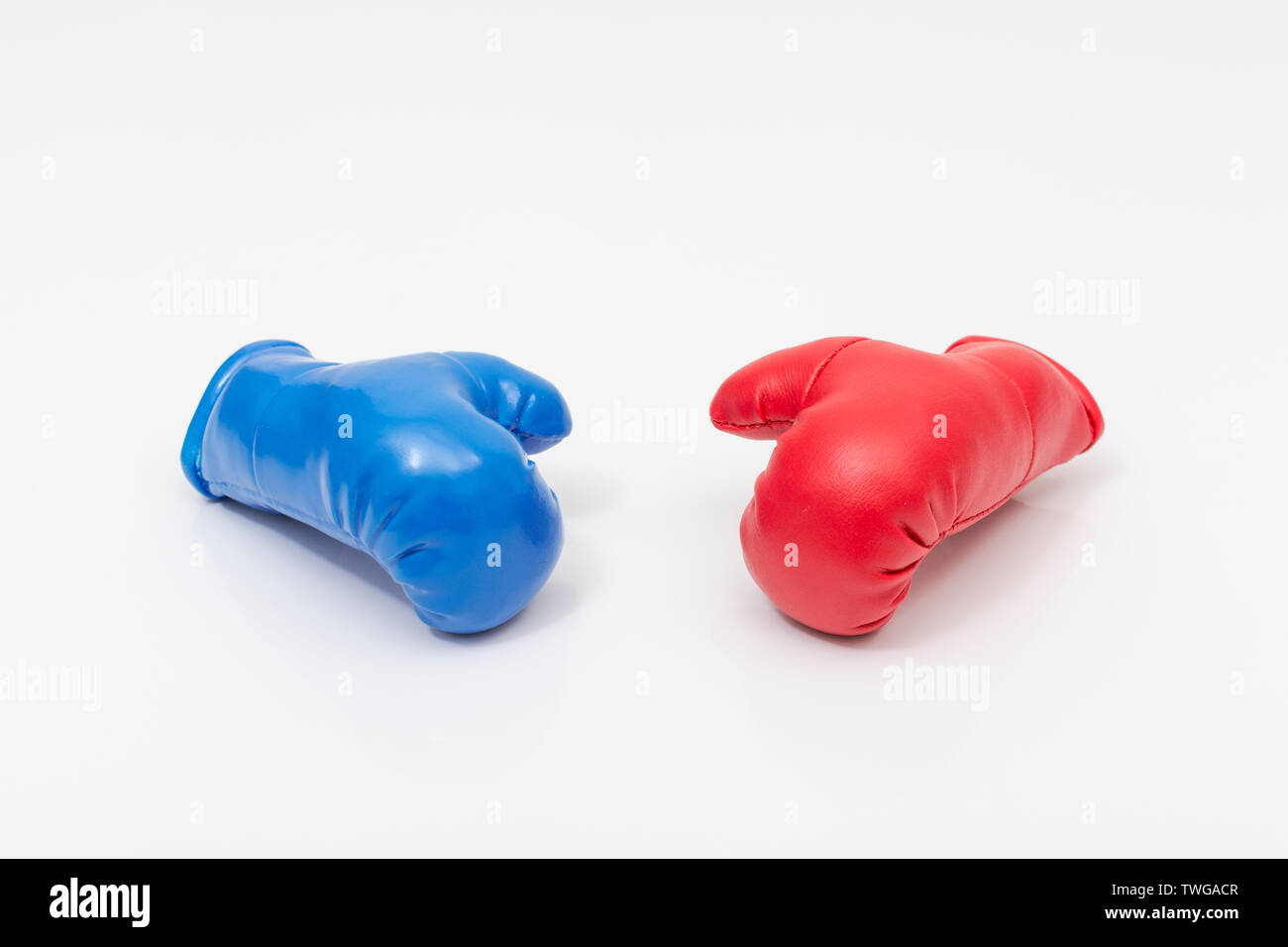 Mini red & blue boxing gloves. Political fight, liberal v conservative ...