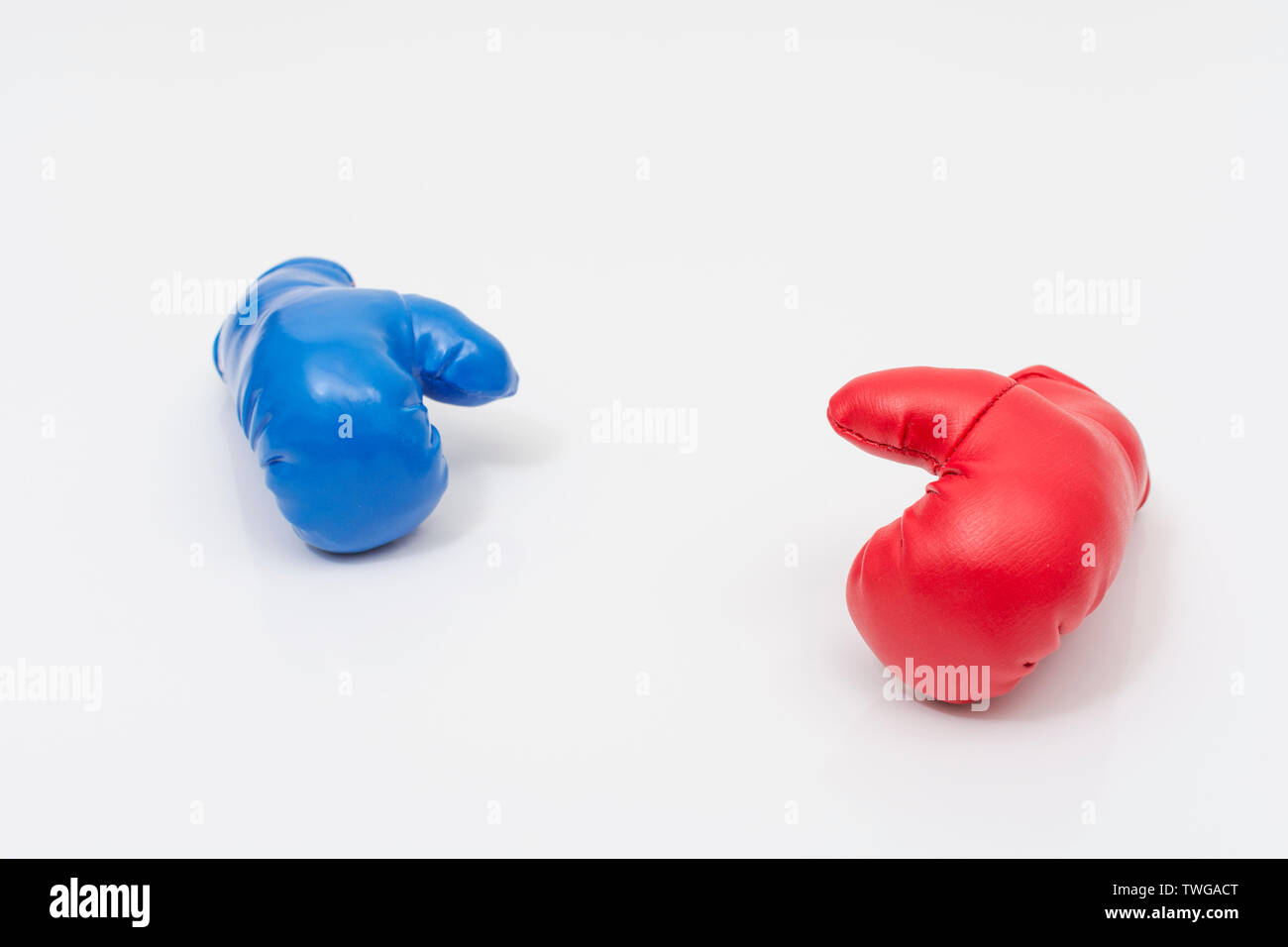 Mini red & blue boxing gloves. Political fight, liberal v conservative ...