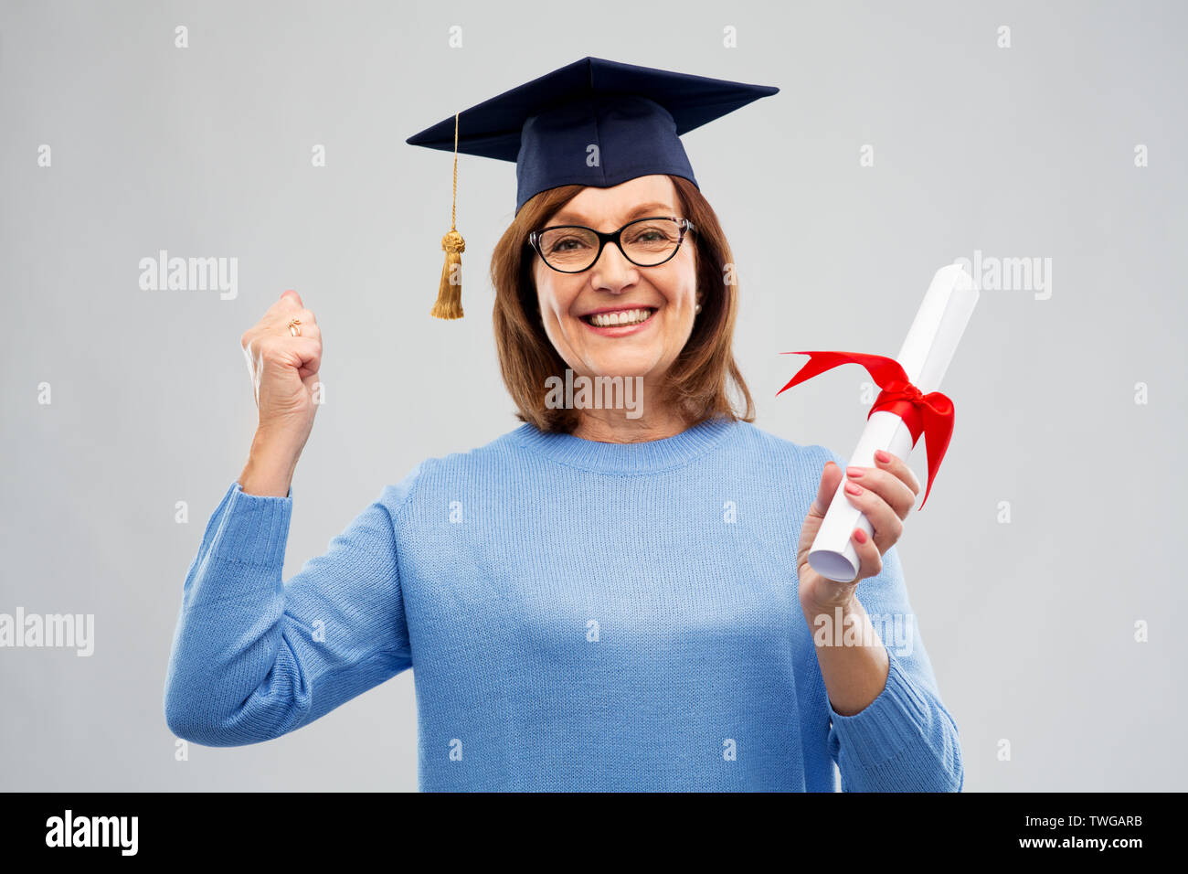happy senior graduate student woman with diploma Stock Photo - Alamy