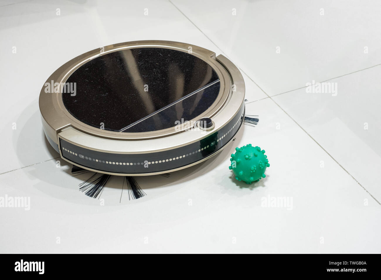 Robot Vacuum cleaner with green Pathogenic Bacteria on tile floor in ...