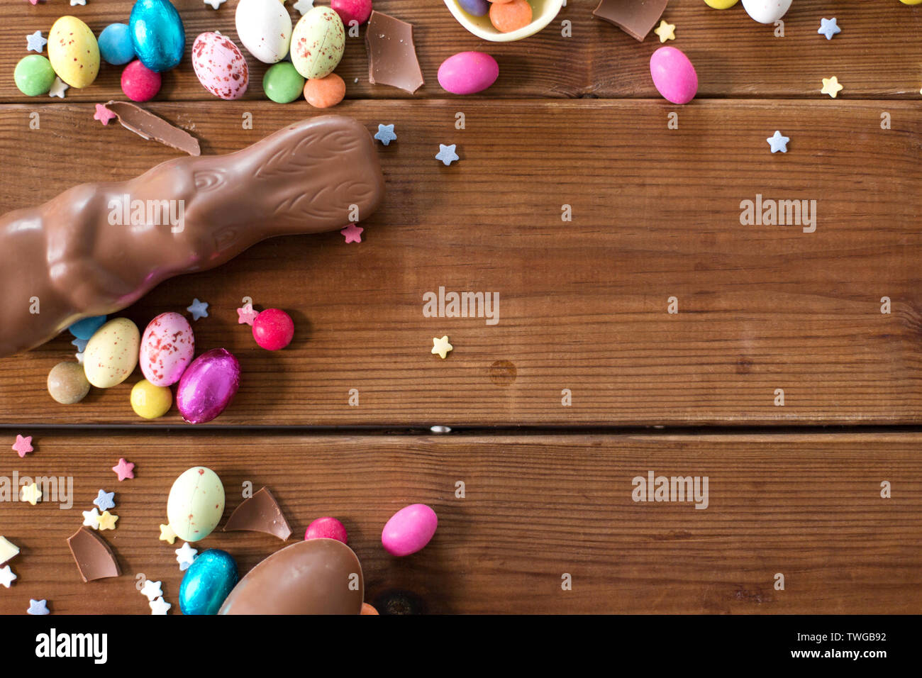 chocolate eggs, easter bunny and candies on wood Stock Photo - Alamy