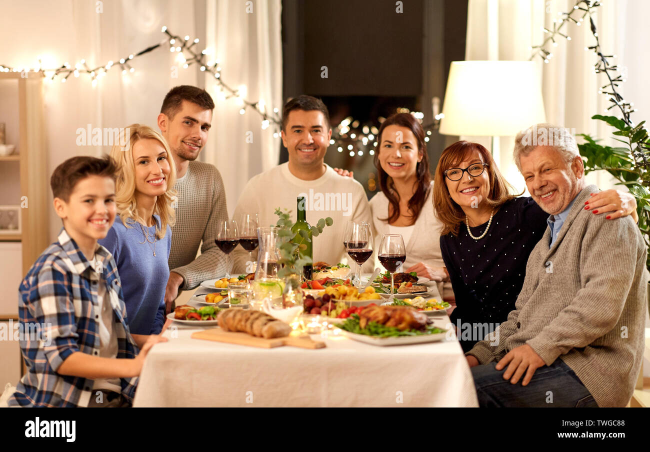 happy family having dinner party at home Stock Photo - Alamy