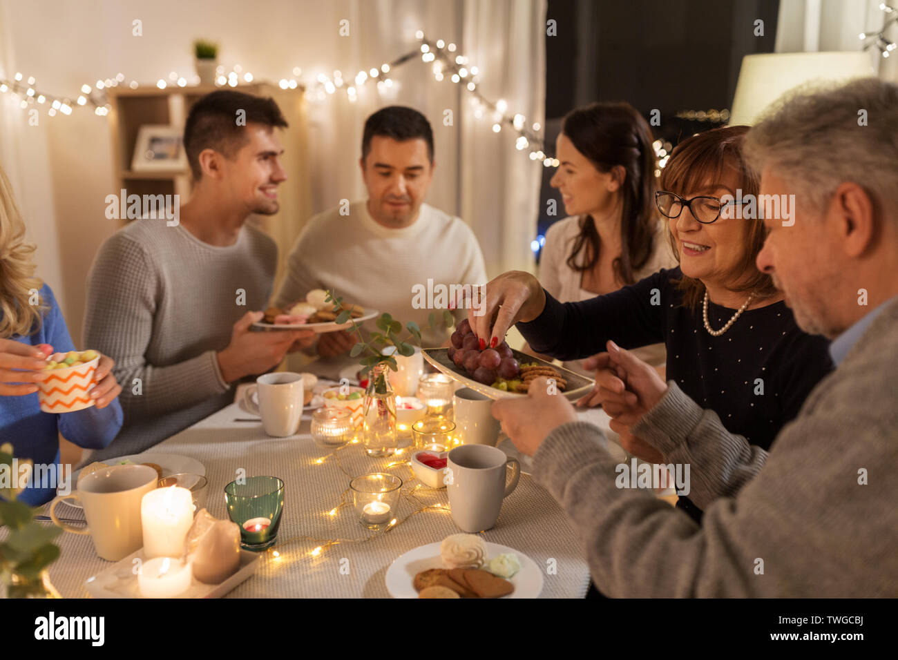 happy family having tea party at home Stock Photo - Alamy