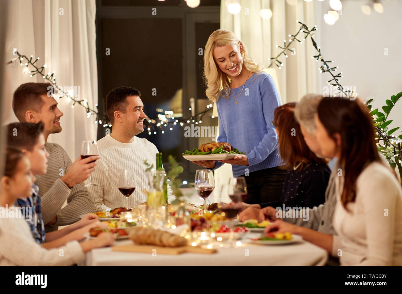 happy family having dinner party at home Stock Photo - Alamy