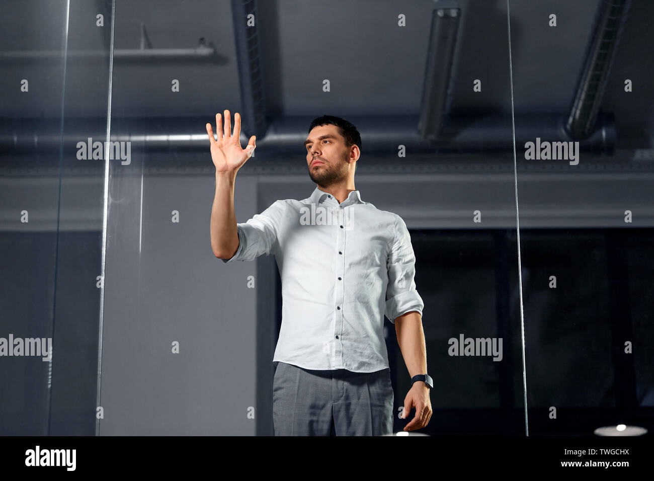 Person touching wall screen hi-res stock photography and images - Alamy