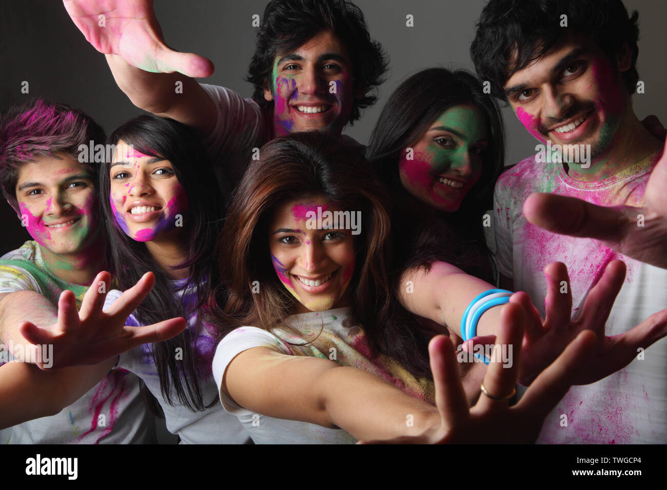 Group of friends celebrating holi festival Stock Photo - Alamy