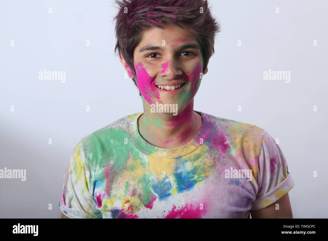 Indian young man celebrating holi festival Stock Photo - Alamy