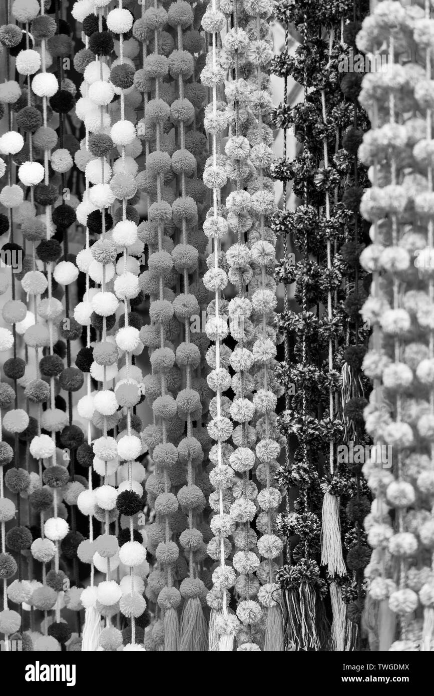 Decorative pom-poms hanging in a Chiapas market as a background texture ...