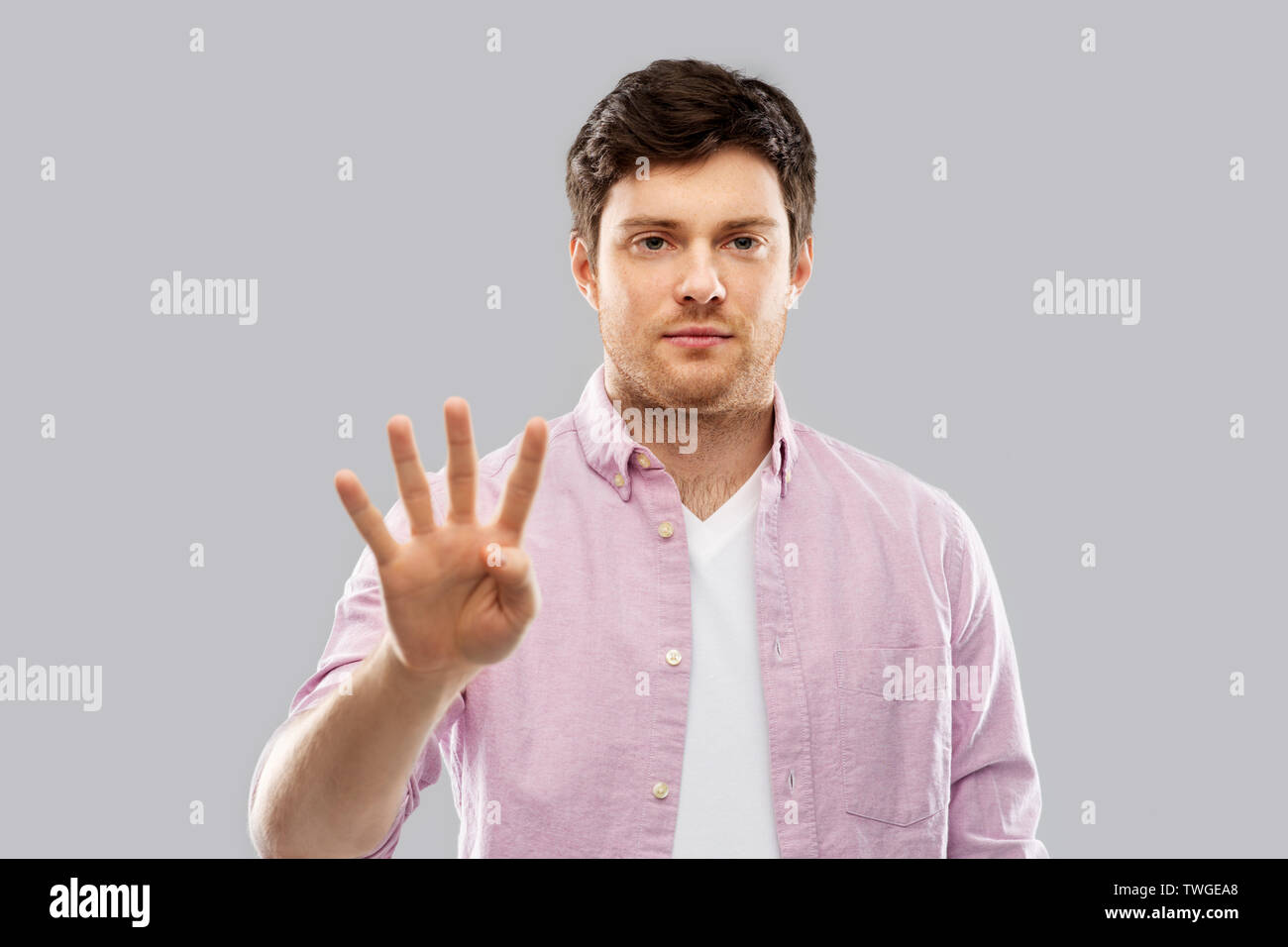Male hand showing four fingers hi-res stock photography and images - Alamy
