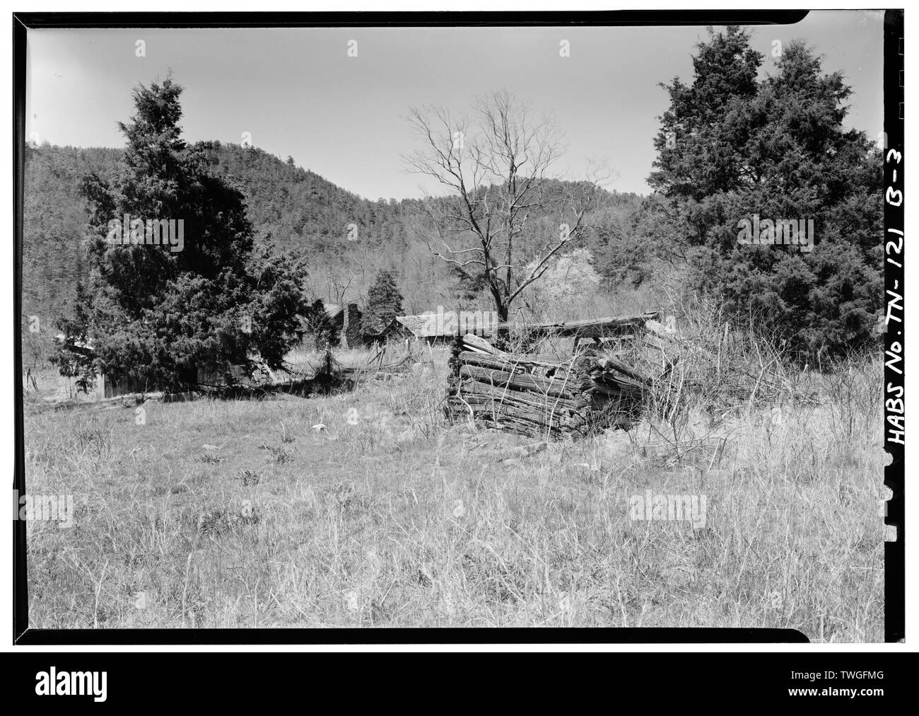 REAR VIEW. The Big House (left) and the Corn Crib are in the background ...
