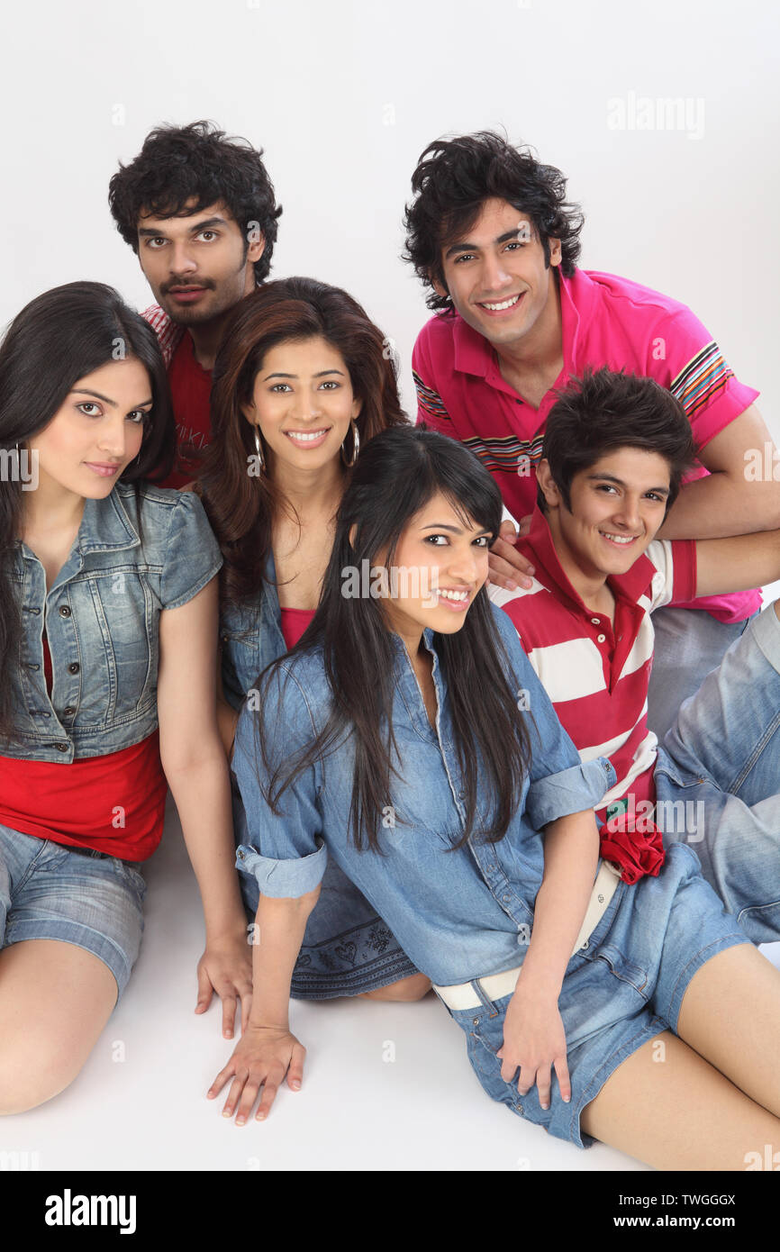 Group of friends sitting together Stock Photo - Alamy