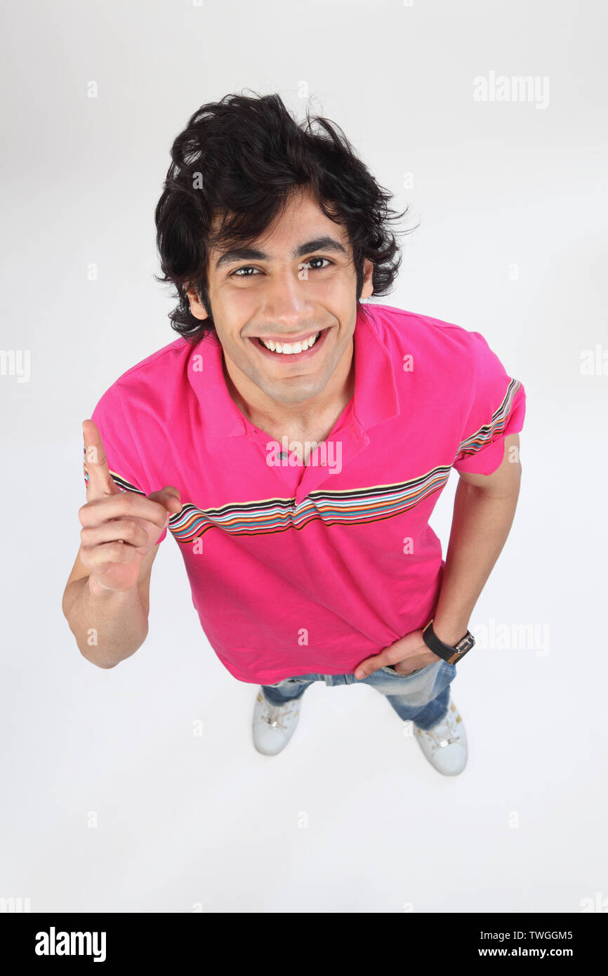 High angle view of a man pointing upward and smiling Stock Photo - Alamy