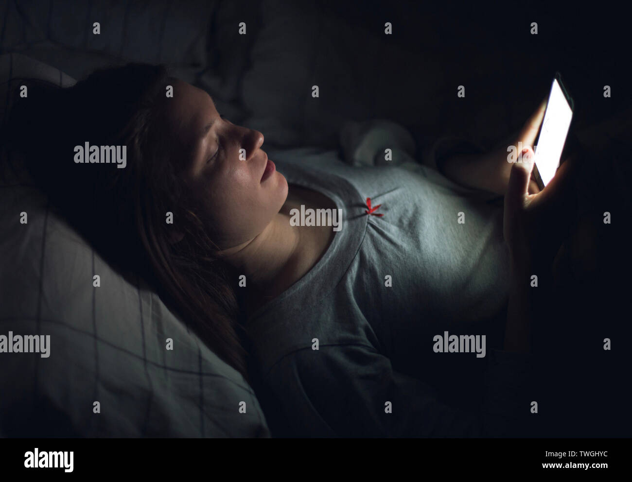 Woman dark room bed hi-res stock photography and images - Alamy