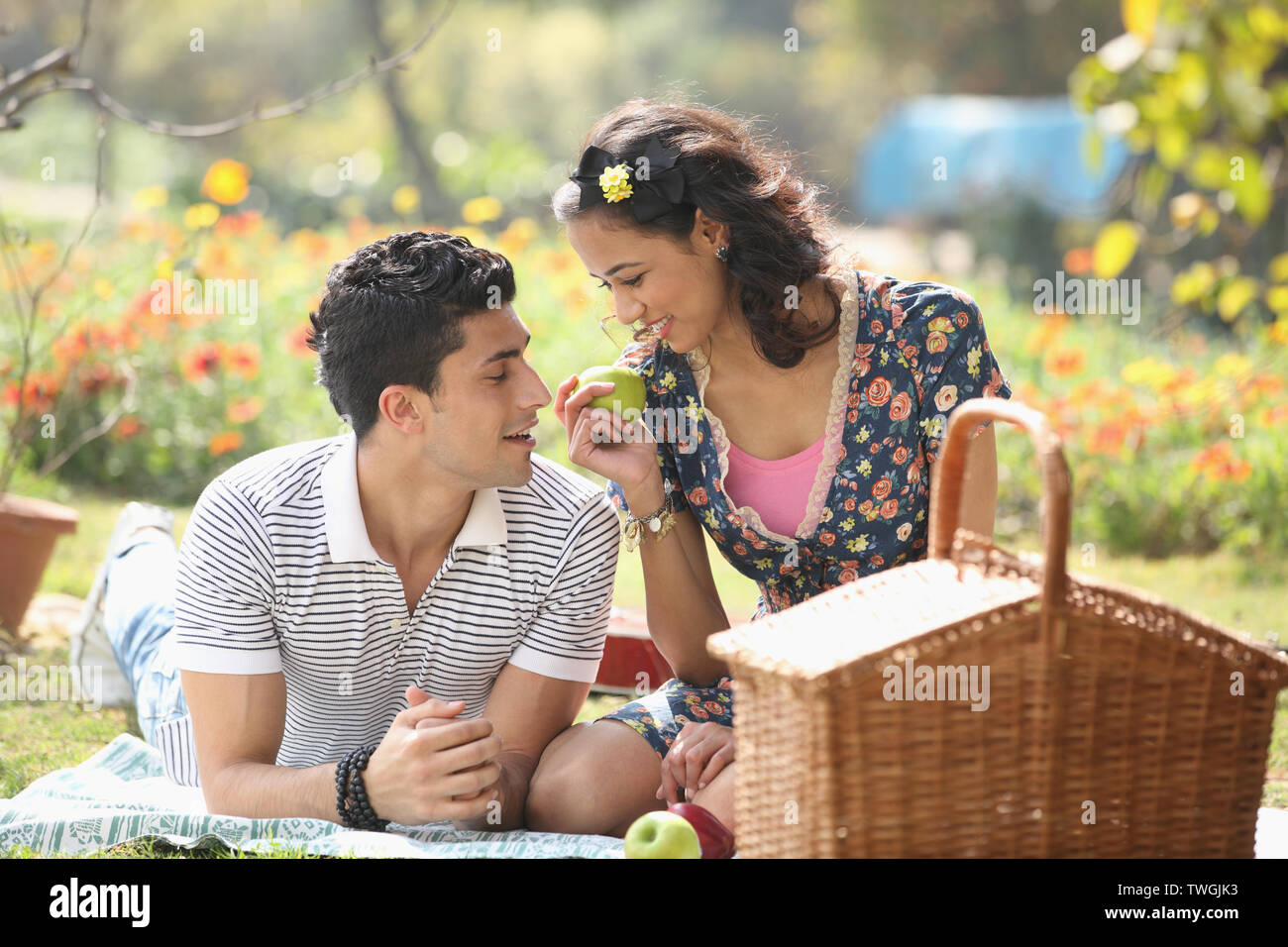 Couple enjoying picnic in a park Stock Photo - Alamy Couple enjoying picnic in a park Stock Photo - Alamy