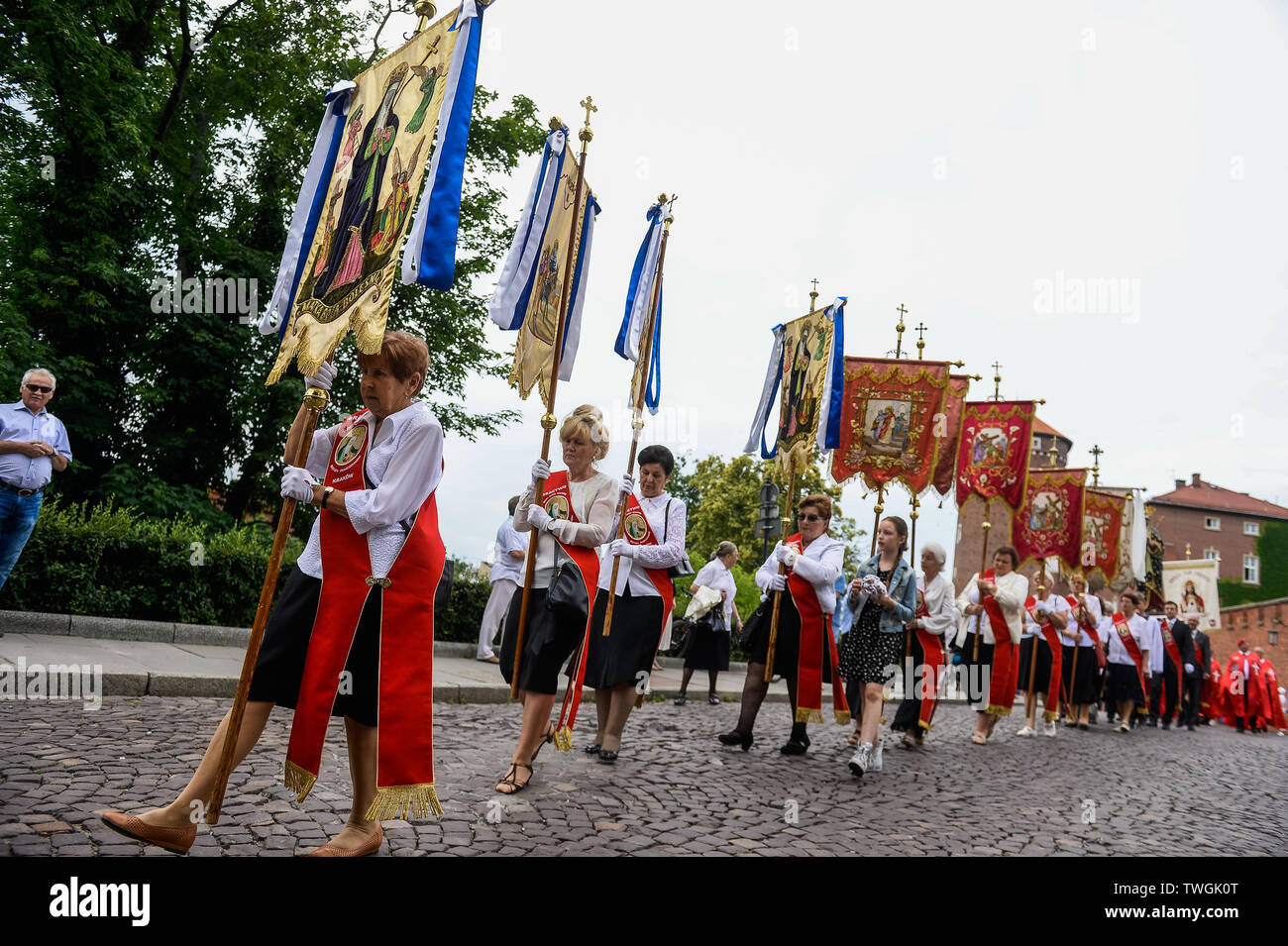 Believers hold religious symbols before the start of the religious ...