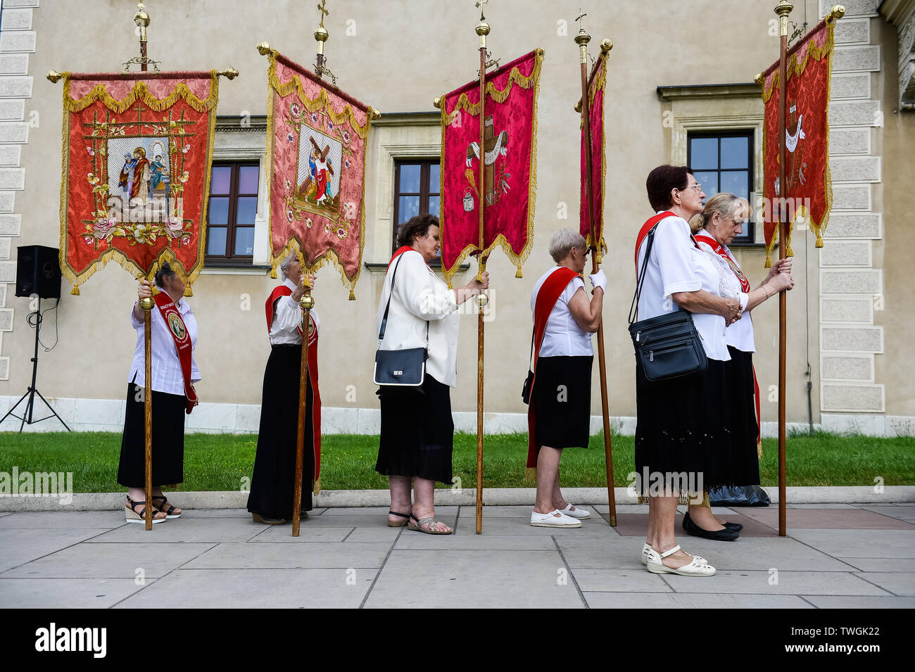 Believers hold religious symbols before the start of the religious ...