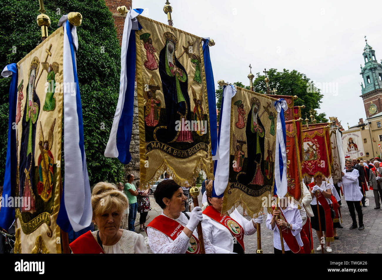 Believers hold religious symbols before the start of the religious ...