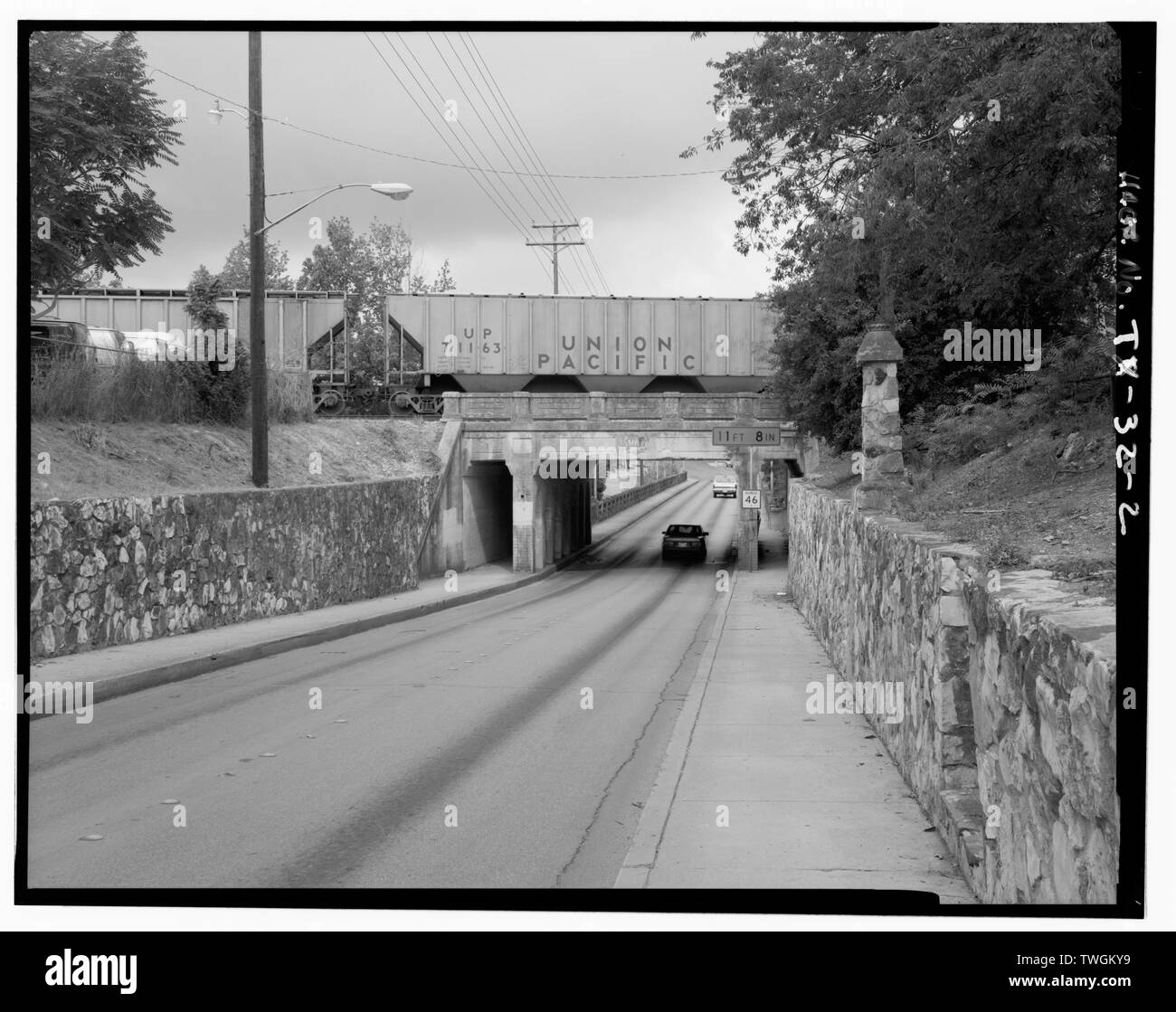 RETAINING WALLS LEADING TO RR OVERPASS FROM SE. - Comal Creek Bridge ...