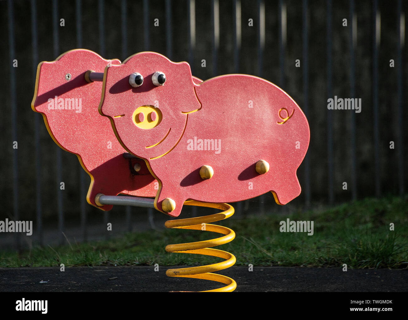 Playground pig rocking chair hi-res stock photography and images - Alamy