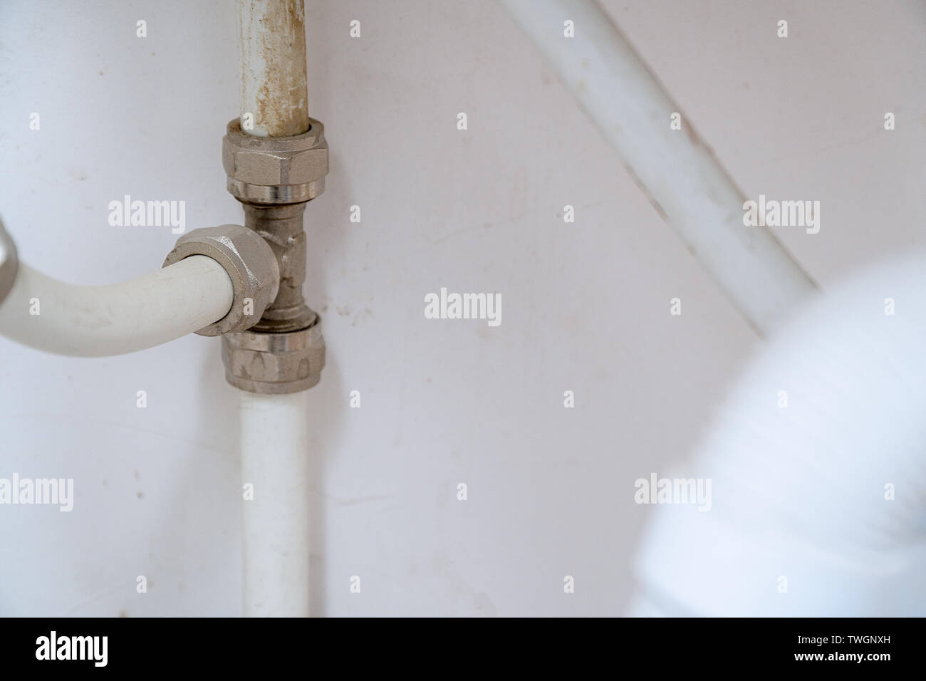 Old connection fitting tee on plastic pipes Stock Photo - Alamy